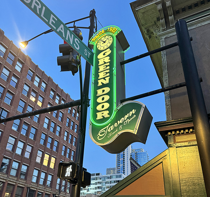 The iconic neon sign glows against the Chicago skyline, a beacon for those seeking authentic experiences in the Windy City.