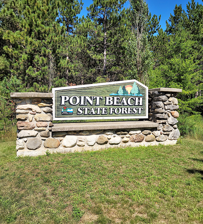 The stone entrance sign welcomes visitors to Point Beach State Forest, nature's version of a "Home Sweet Home" doormat.