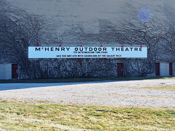 The McHenry Outdoor Theatre marquee announces upcoming features, a beacon of entertainment visible from the road.