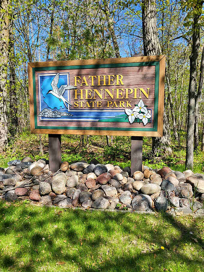 The welcoming sign stands as a promise of natural wonders ahead, where Father Hennepin State Park begins its magic.