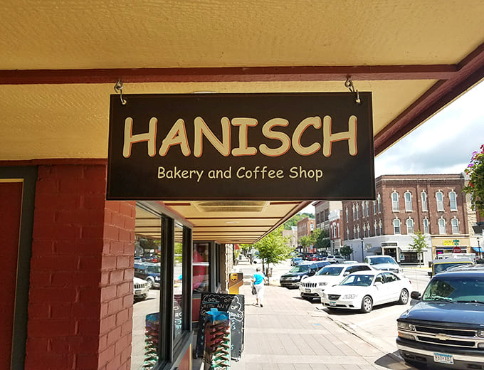 The classic signage announces Hanisch Bakery and Coffee Shop with pride, marking the spot where countless locals and visitors have found their new favorite place to indulge.