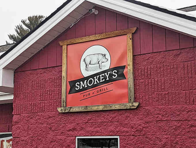 The Smokey's sign featuring their pig logo &ndash; a simple, honest declaration of what awaits inside: pork prepared with respect and skill.