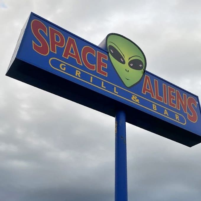 The beacon that guides hungry travelers to this cosmic culinary outpost &ndash; promising an experience that's truly out of this world.