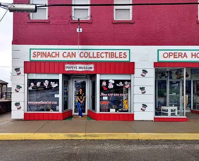 The distinctive storefront of Spinach Can Collectibles beckons visitors with its red-and-white striped awning, promising nostalgic treasures and childhood memories inside.