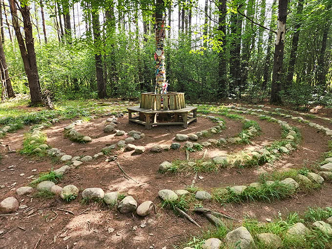 A woodland labyrinth of stone and earth! This meditative spiral path leads to a central gathering spot, where colorful ribbons dance from a tree like whispered prayers.