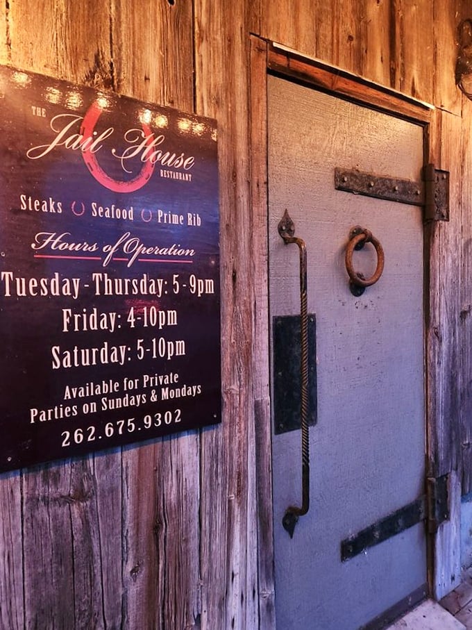 The restaurant's rustic wooden door and signage set the perfect tone for the authentic experience waiting inside.