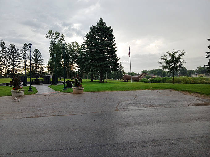 The park setting provides perfect context for Otto's grandeur, with amenities for visitors who come to worship at his concrete feet.