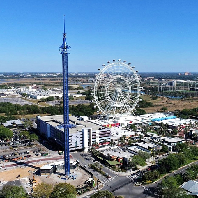 Standing tall beside the Orlando Eye, proving that in the competition for sky dominance, sometimes the skinny kid wins.