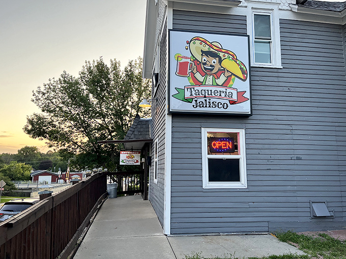 Taqueria Jalisco's cheerful sign promises authentic Mexican flavors that transport taste buds far beyond Minnesota's borders.