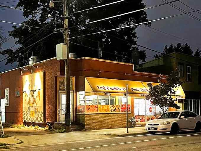 As evening falls, Ted Cook's glows like a barbecue lighthouse, beckoning hungry travelers with promises of smoky delights. A beacon of traditional barbecue in modern times.