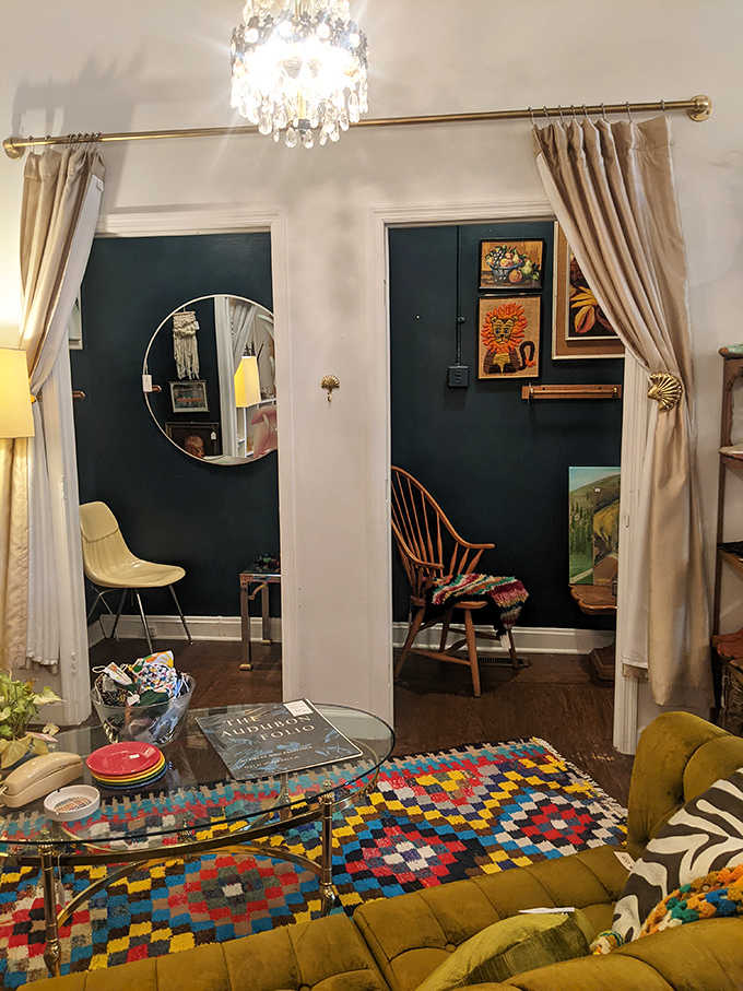 Elegant archways and carefully arranged vignettes make the space feel like a stylish home rather than a store, inviting you to imagine these pieces in your own space.