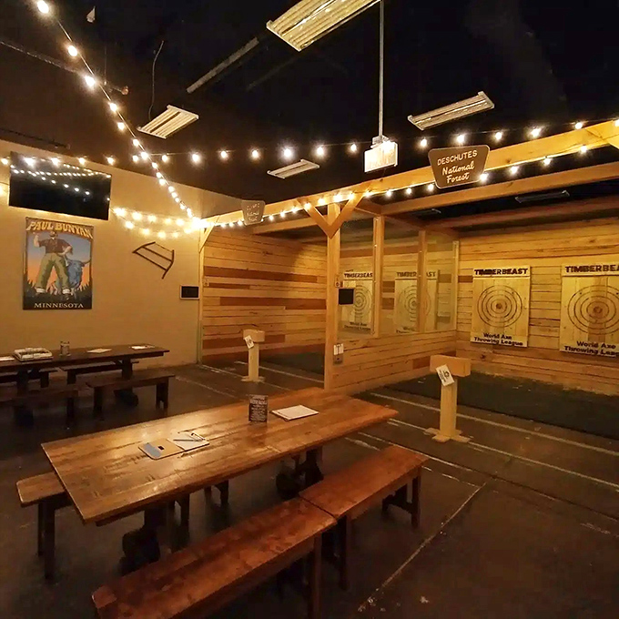 TimberBeast Axe Throwing combines rustic charm with primal satisfaction – string lights overhead while axes thunk satisfyingly into wooden targets below.