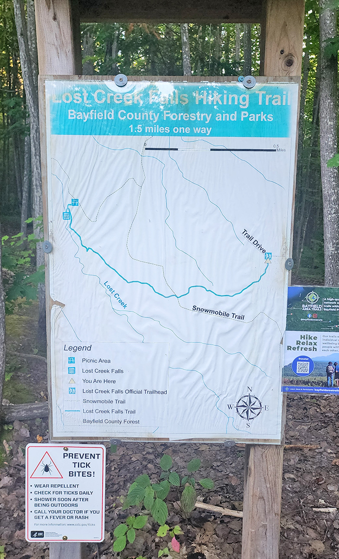 Trail maps orient visitors at the trailhead, promising a 1.5-mile journey to Wisconsin's best-kept secret &ndash; worth every step.