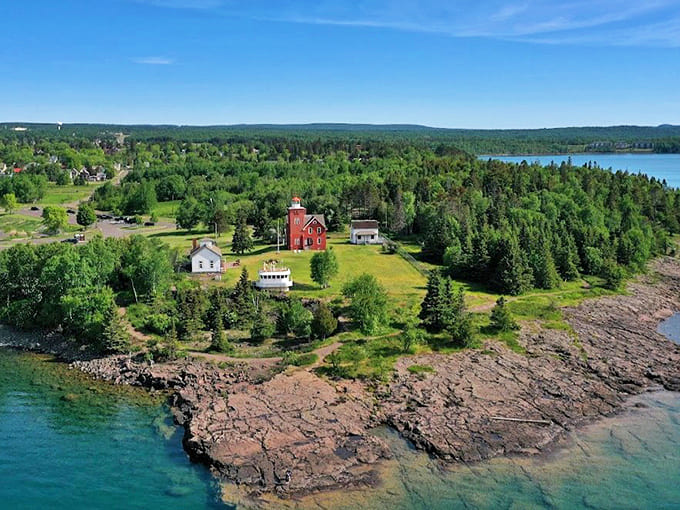 From above, the lighthouse's strategic position becomes clear &ndash; a perfect vantage point where land meets the mighty waters of Lake Superior.