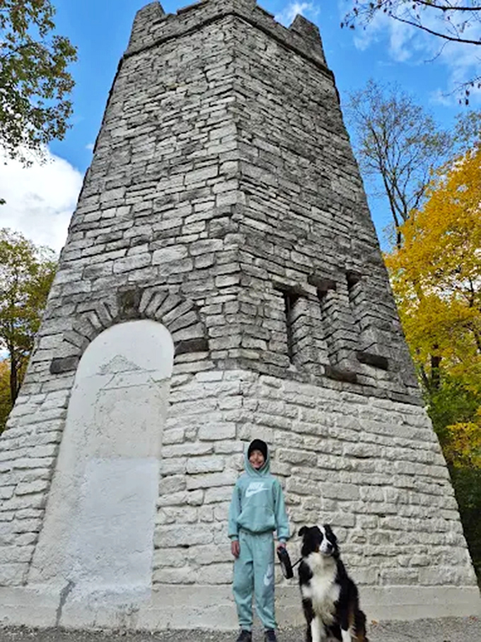 Scale provides perspective as visitors pose beside the tower &ndash; this isn't just a folly, it's a substantial piece of Cincinnati history.