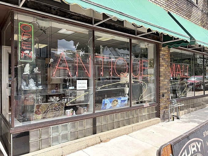 The storefront promises adventure within its walls. That neon "OPEN" sign might as well say "Portal to the Past&mdash;Enter at Risk to Your Schedule."
