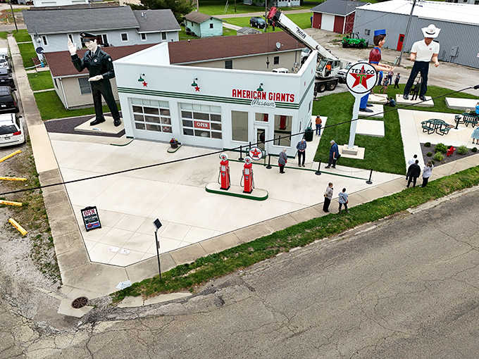 This aerial view reveals the museum's impressive collection of outdoor giants, standing tall against the Illinois landscape like guardians of American roadside history.