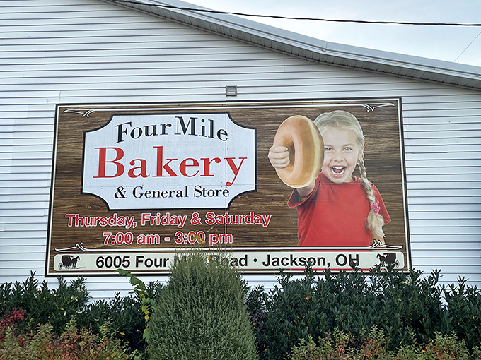The iconic sign that beckons hungry travelers from miles around. That little girl knows what you're about to discover &ndash; donut bliss awaits!