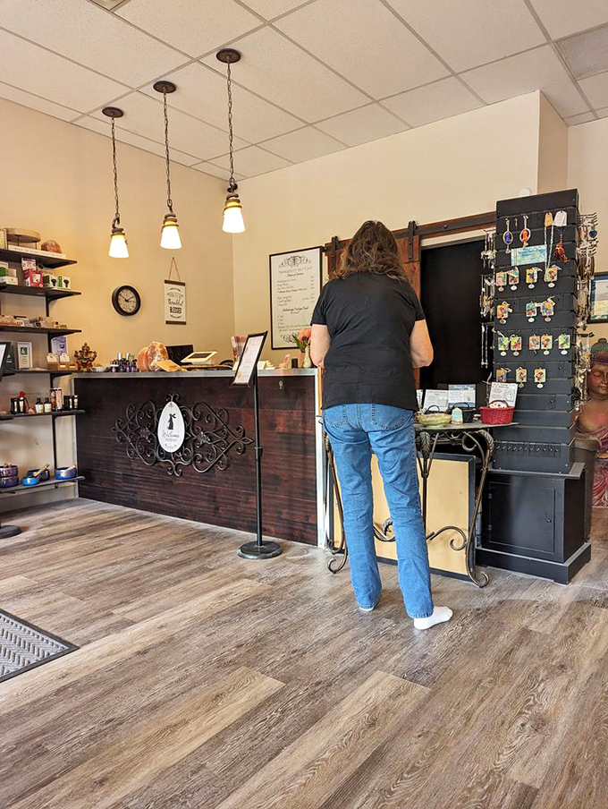At the reception desk, friendly staff members guide newcomers through their first salt cave experience with genuine warmth and expertise.