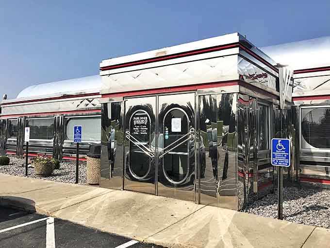 The diner's chrome exterior gleams like a time machine on wheels, beckoning travelers to step back into a simpler, more delicious era.