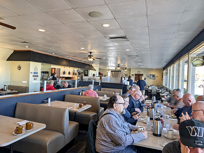 The dining room buzzes with breakfast energy &ndash; a community united in pursuit of pancake perfection and coffee refills.