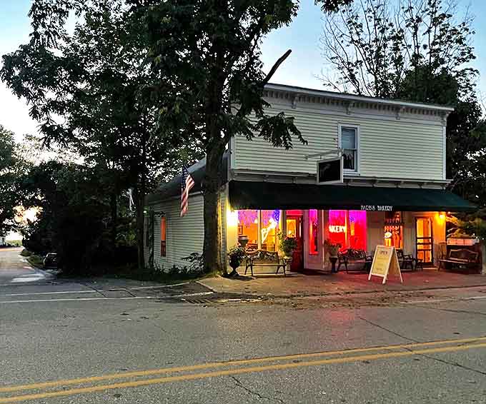 As dusk falls, the bakery's warm glow spills onto Northport's quiet street, a sweet lighthouse guiding pastry pilgrims home even as the day winds down.