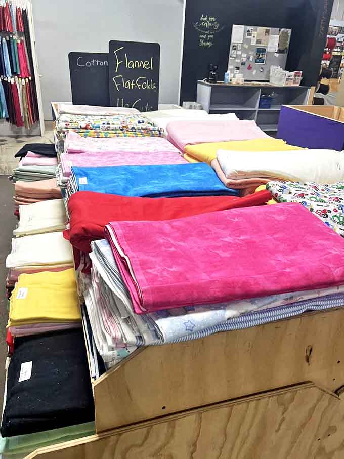 Flannel flat folds stacked like textile pancakes &ndash; each one promising the coziest pajamas you'll ever own.