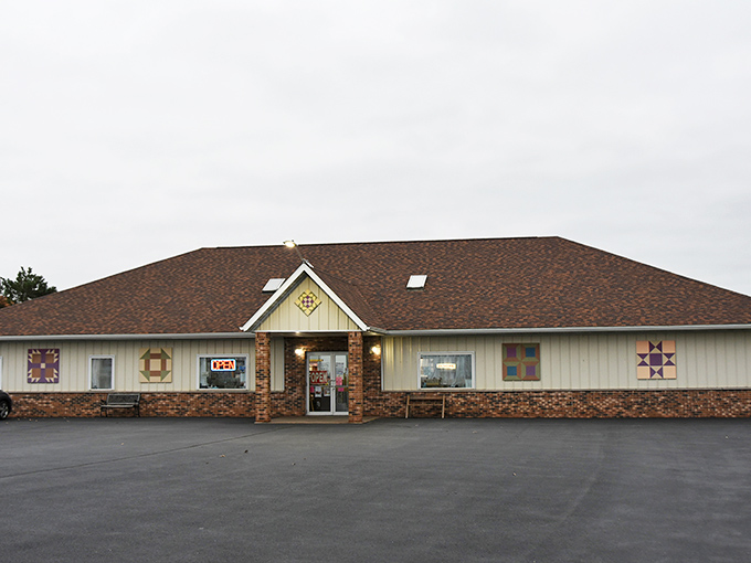 The charming exterior, complete with decorative quilt blocks, offers just a hint of the textile treasures awaiting inside this crafter's paradise.