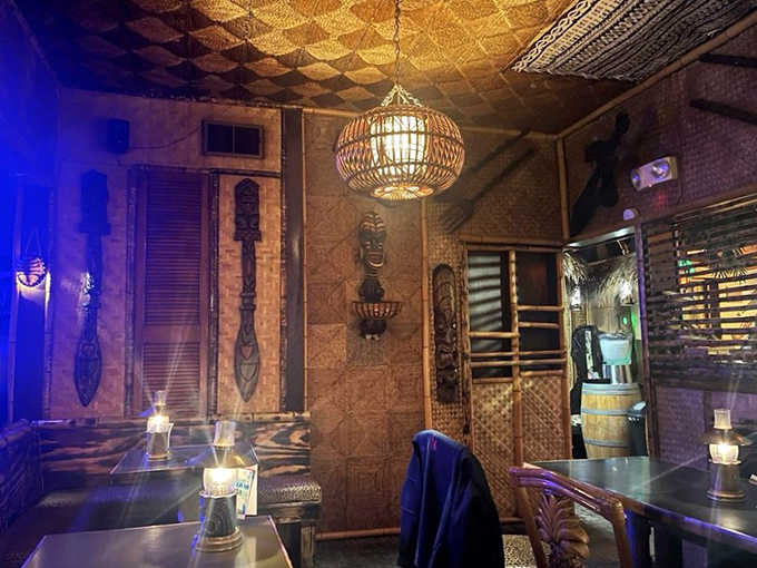 Intimate lighting transforms ordinary evenings into exotic adventures &ndash; bamboo walls and woven accents creating cozy nooks for tropical-inspired conversations.