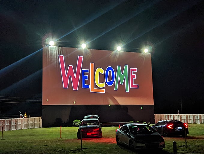 "WELCOME" blazes across the screen in rainbow letters &ndash; a warm greeting that promises an evening of entertainment under the stars.