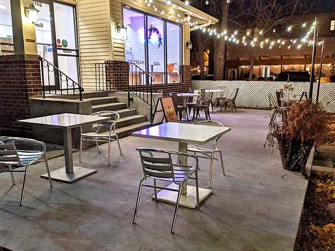 As night falls, the patio becomes an enchanted space where dessert dreams come true under twinkling lights and starry skies.