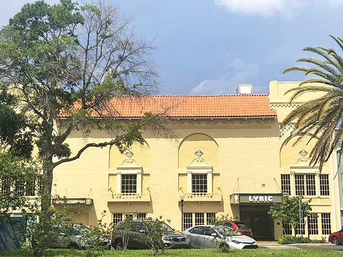 Bathed in Florida sunshine, the Lyric's Mediterranean Revival fa&ccedil;ade stands as a cream-colored testament to an age when even building exteriors told a story worth remembering.