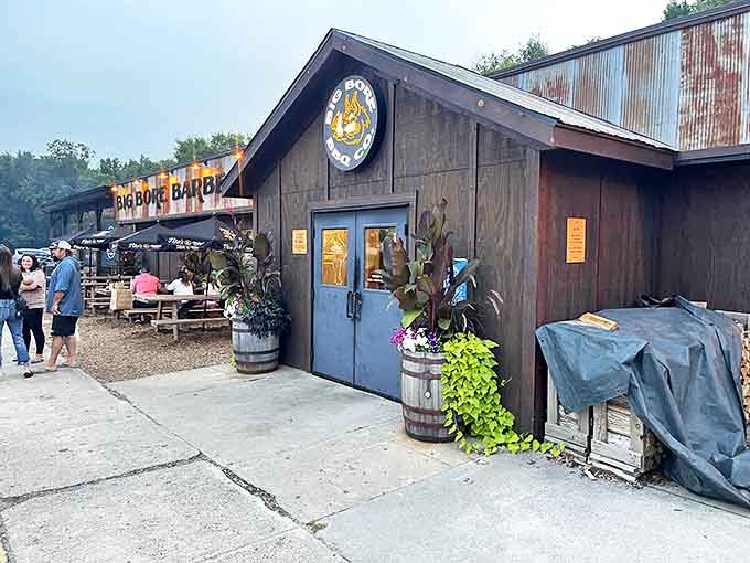 The outdoor area welcomes guests with rustic charm, wooden barrels, and picnic tables &ndash; because barbecue tastes even better in the fresh air.