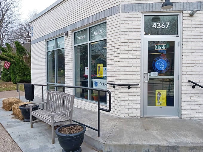 The entrance to dessert paradise &ndash; Dancing Bear's welcoming storefront with its simple bench invites you to sit and savor your sweet discoveries.