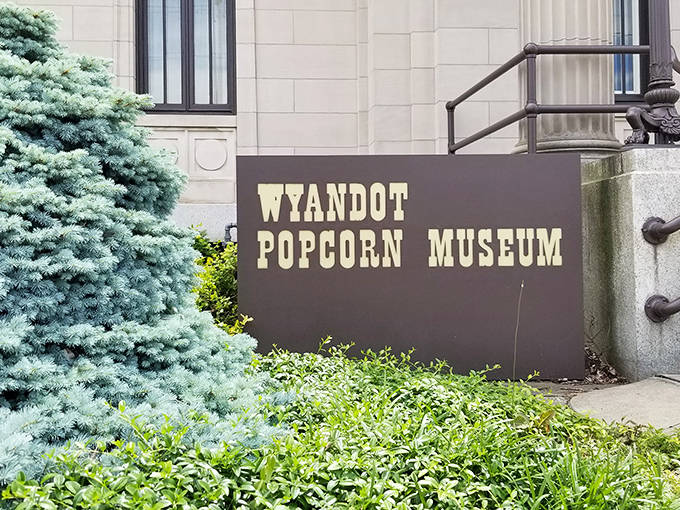 The unassuming entrance to a world of wonder. Behind this simple sign lies America's premier collection of popcorn history&mdash;proof that extraordinary experiences often hide in plain sight.
