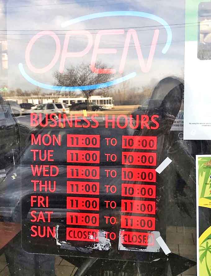 Business hours posted on the door &ndash; each representing an opportunity to transport yourself to Jamaica through the universal language of delicious food.