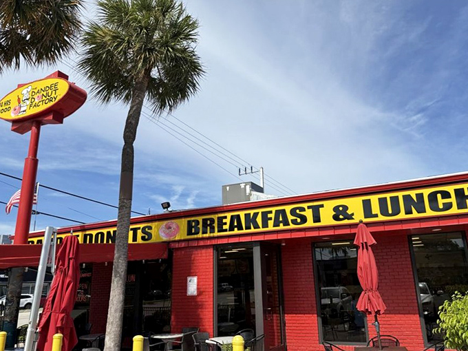 That iconic signage promises exactly what awaits inside: donuts, breakfast, and lunch worth traveling across town for.