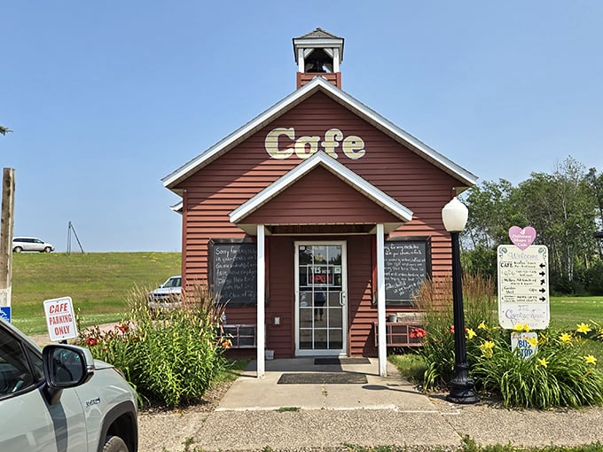 The welcoming entrance, framed by cheerful flowers, invites hungry travelers to step inside and be schooled in the fine art of comfort food.