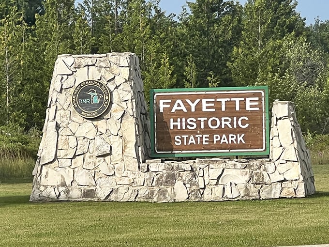 The welcoming entrance sign promises visitors a perfect blend of outdoor recreation and historical exploration in Michigan's Upper Peninsula.
