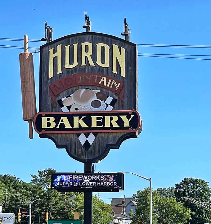 The iconic Huron Mountain Bakery sign stands as a beacon for carb-lovers, a landmark that signals delicious adventures await.