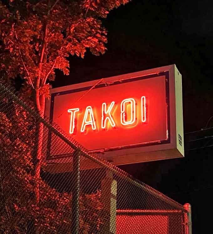 That red neon sign cuts through the night &ndash; a beacon for flavor-seekers and the unofficial starting line for culinary adventure.