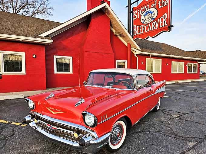The vintage sign outside matches that classic red exterior, announcing to the world that yes, this is indeed where the beef magic happens daily.