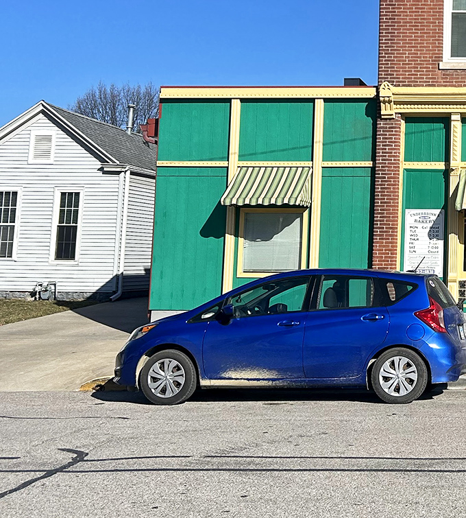 A splash of color against the brick exterior, this small-town gem proves that sometimes the sweetest destinations come in unassuming packages.