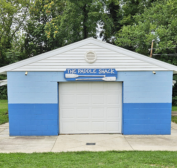 The blue and white Paddle Shack stands ready to equip adventurers for water-based explorations of Lake Erie's shoreline.