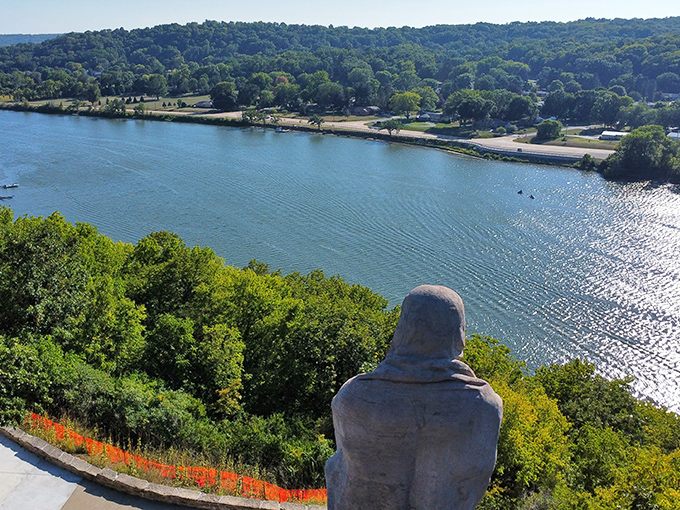 The Rock River provides a serene foreground to this monumental backdrop, reflecting centuries of history flowing beneath the watchful stone gaze.