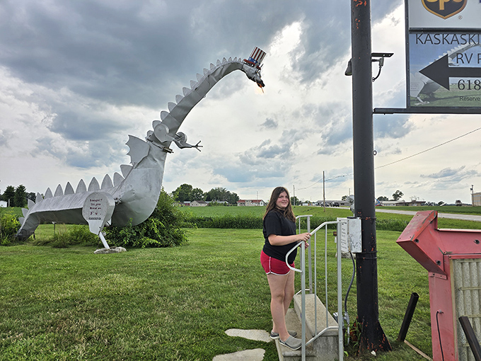 A visitor prepares to experience the dragon's fiery breath, that moment of anticipation before flames shoot dramatically skyward.