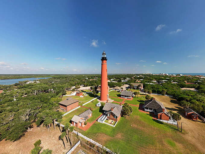 The red giant stands tall against the coastal landscape, a 175-foot testament to human ingenuity that's been saving lives since before your great-grandparents were born.
