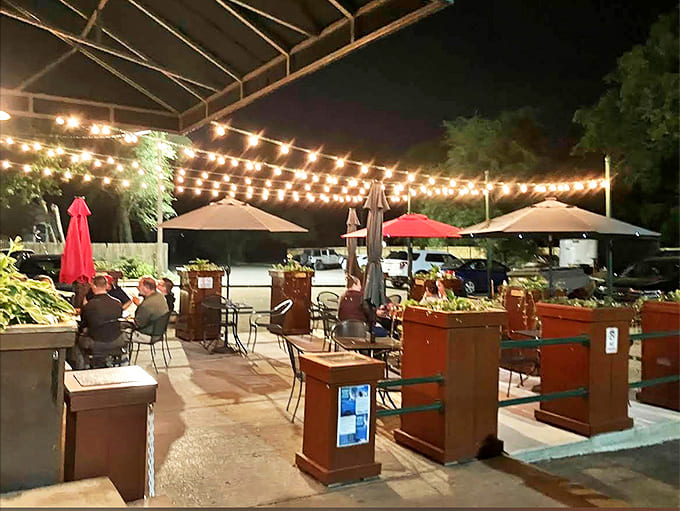 Outdoor Seating: String lights transform the patio into an urban oasis where summer evenings stretch deliciously into night over cold drinks.