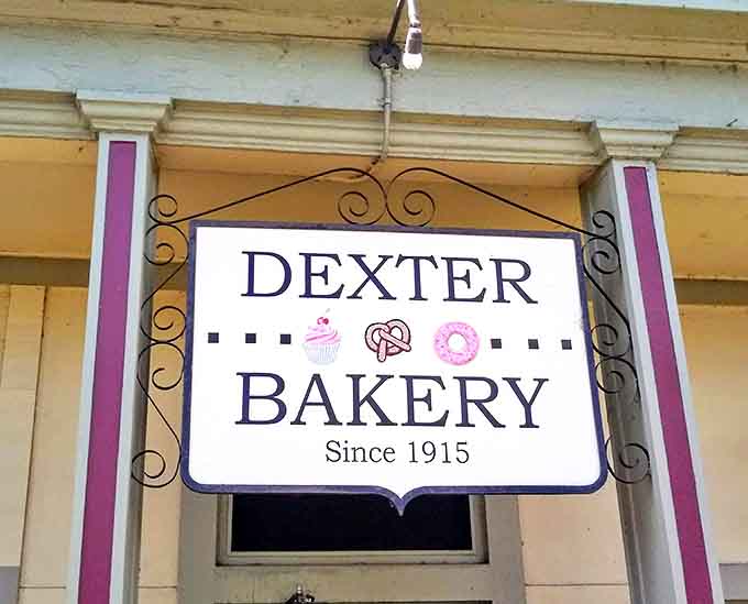 The vintage sign hanging above the entrance doesn't just announce a bakery &ndash; it promises a tradition of excellence since 1915.