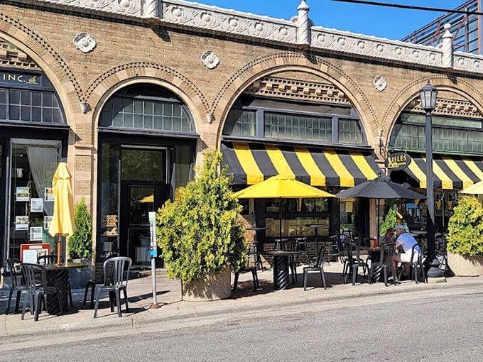 That historic brick facade with arched windows proves beautiful architecture and sticky buns can absolutely coexist harmoniously.